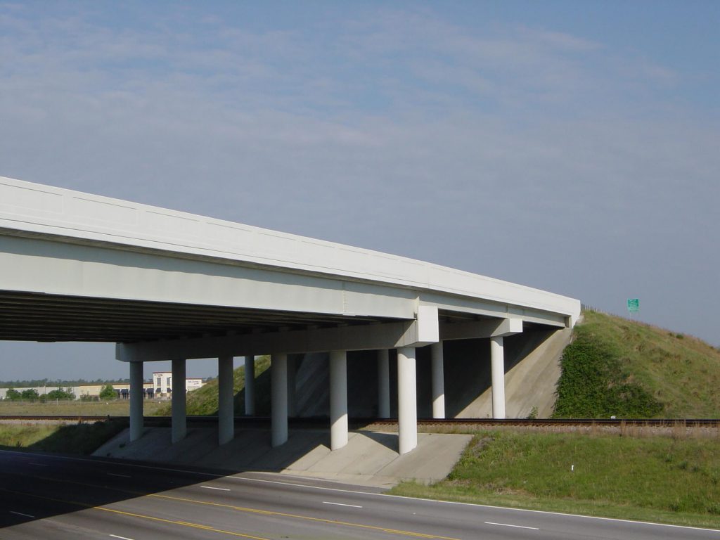 Construction of a steep soil slope near rail road tracks - STRATA GLOBAL