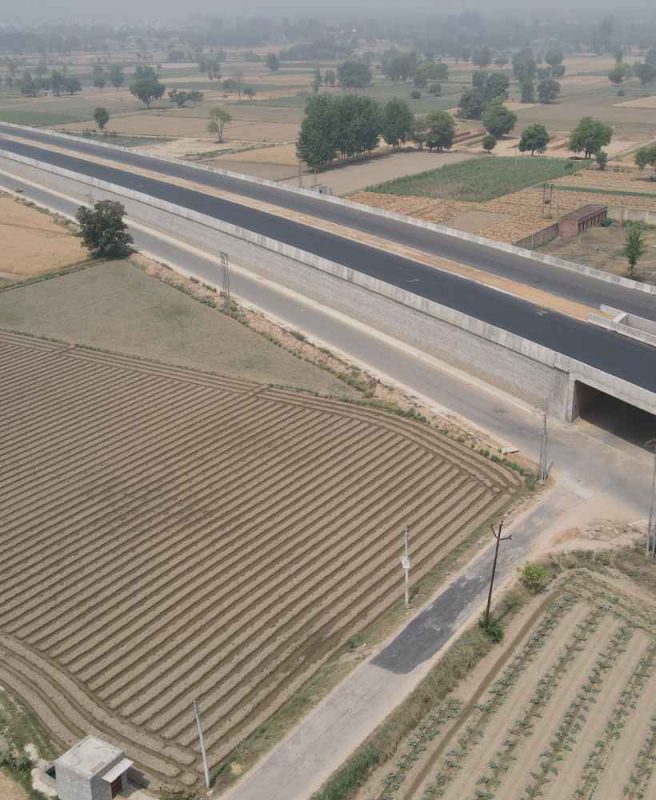 Modular precast T-shaped block for reinforced soil retaining wall